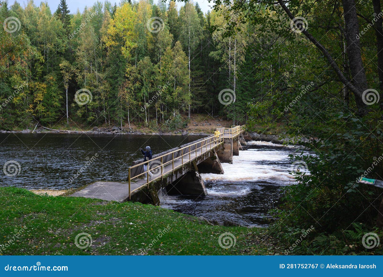 Arched Bridge Over a Wide River Surrounded by Autumn Forest Stock Image ...