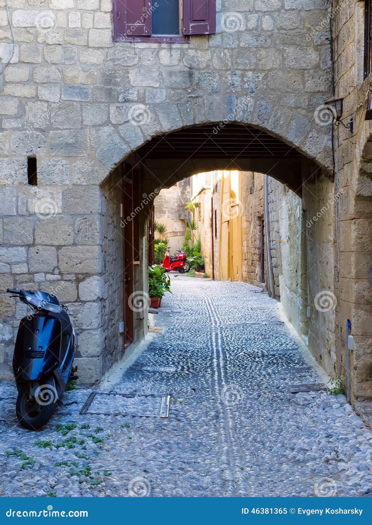 Arched cobblestone lane stock image. Image of medieval - 46381365