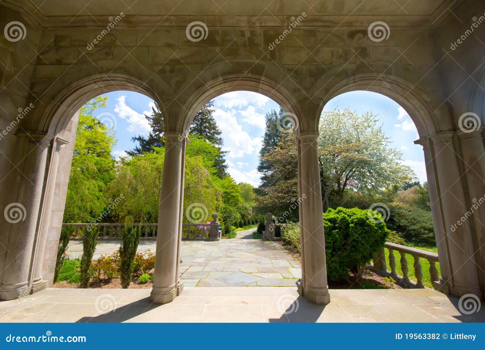 Arched Portico With Stone Brick Wall And Glass Door At The Entrance Of ...