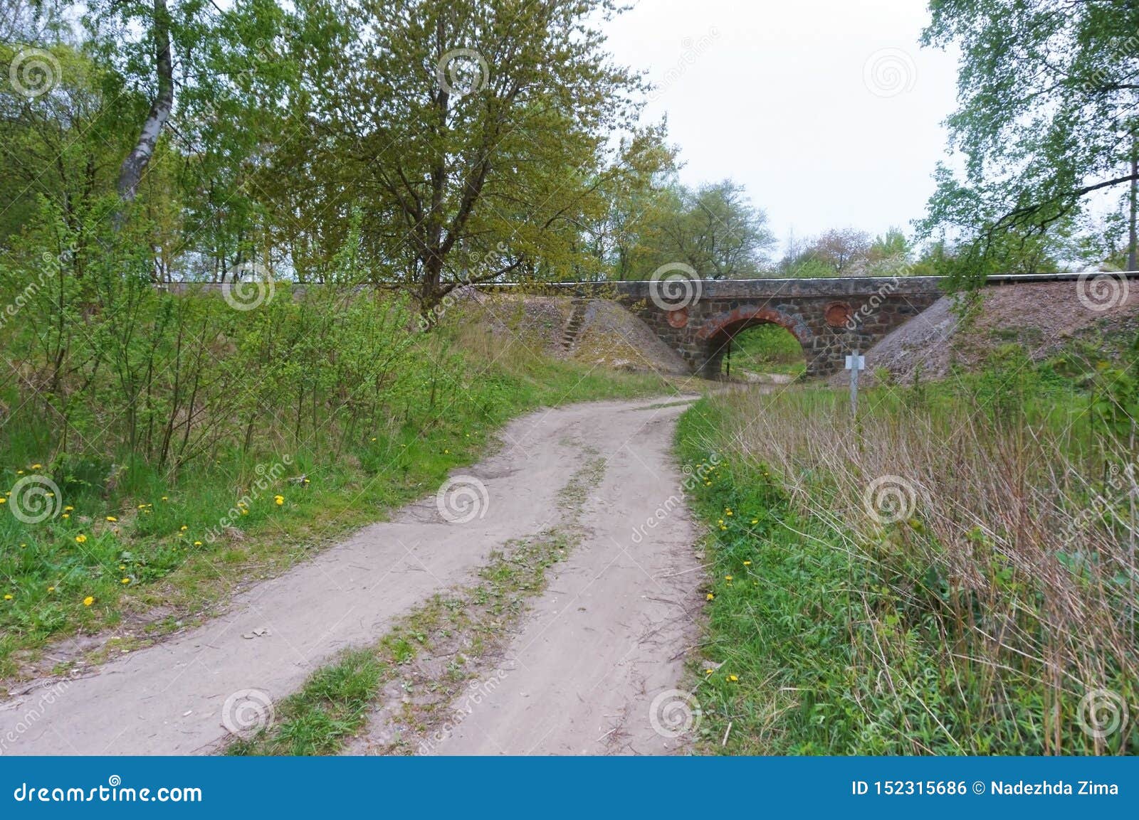 An Arched Railway Bridge Over the Road, Old Stone Viaduct Stock Photo ...
