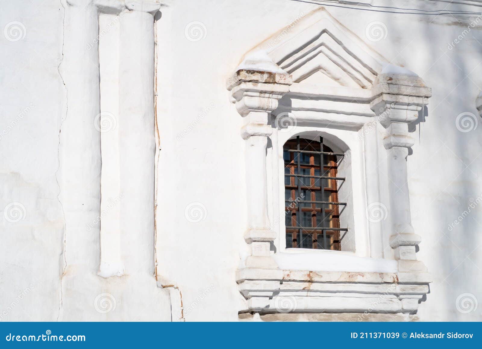 Arched Window in a Brick White-stone Wall of a Temple with a Stone ...