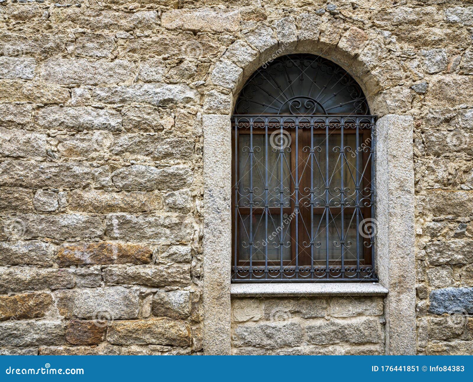Arched Window and Ancient Wall Built with Stones of Various Types and ...