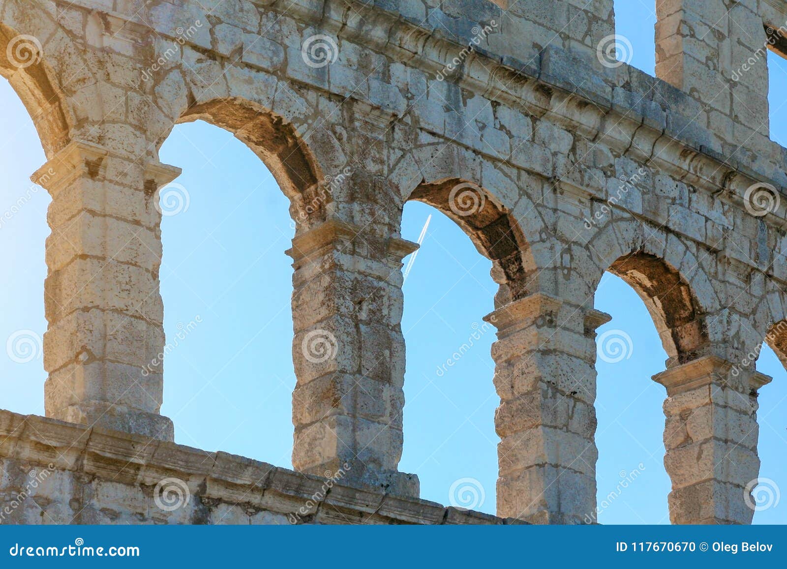 Arched Windows of an Ancient Roman Amphitheater Against the Blue Sky ...