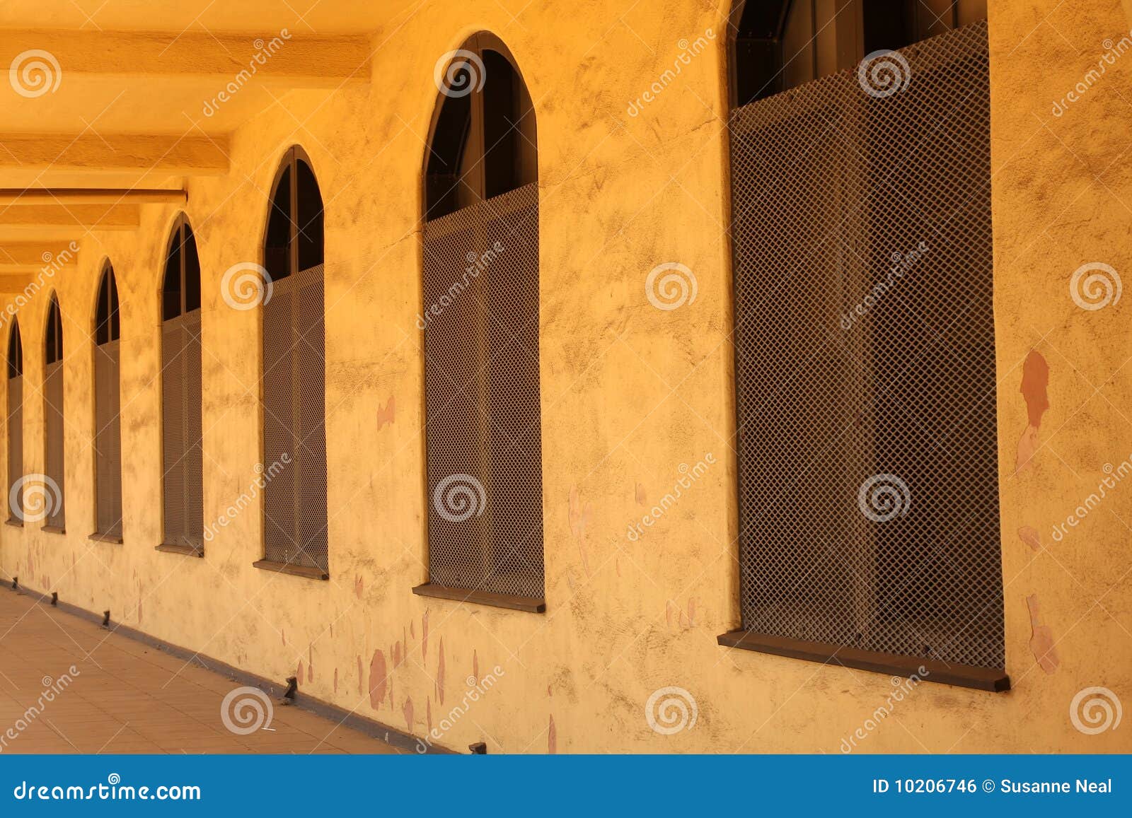 Arched Windows in a Long Hallway Stock Photo - Image of outdoors, wood ...