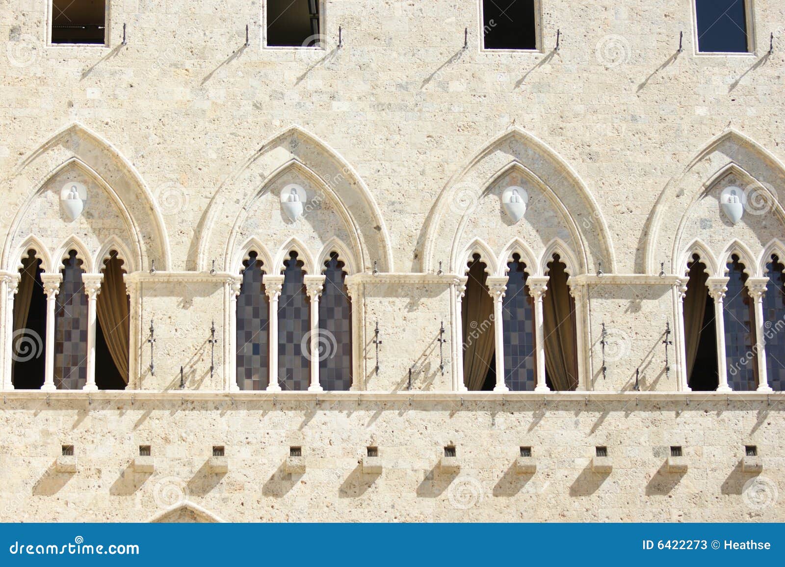 Arched Windows in Sienna Italy Stock Image - Image of carved, facade ...