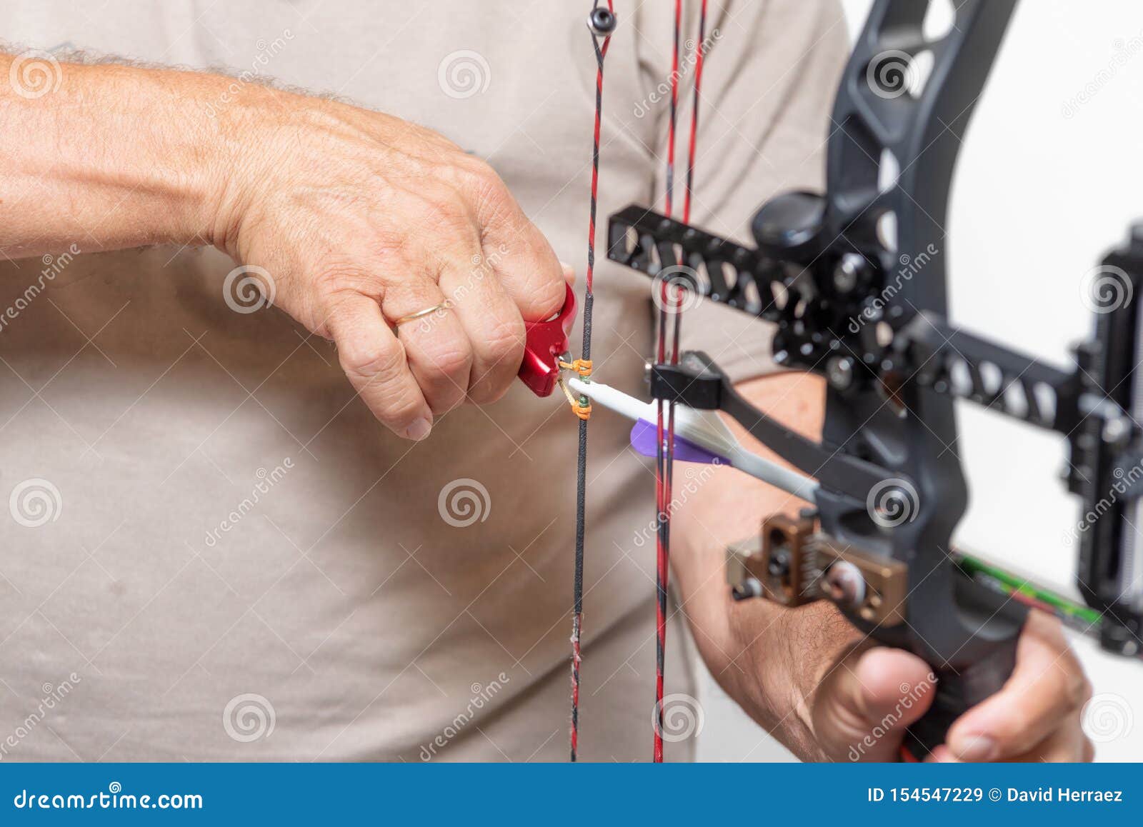 Archer Hands Close Up, Preparing the Arrow for the Shot. Stock Image ...