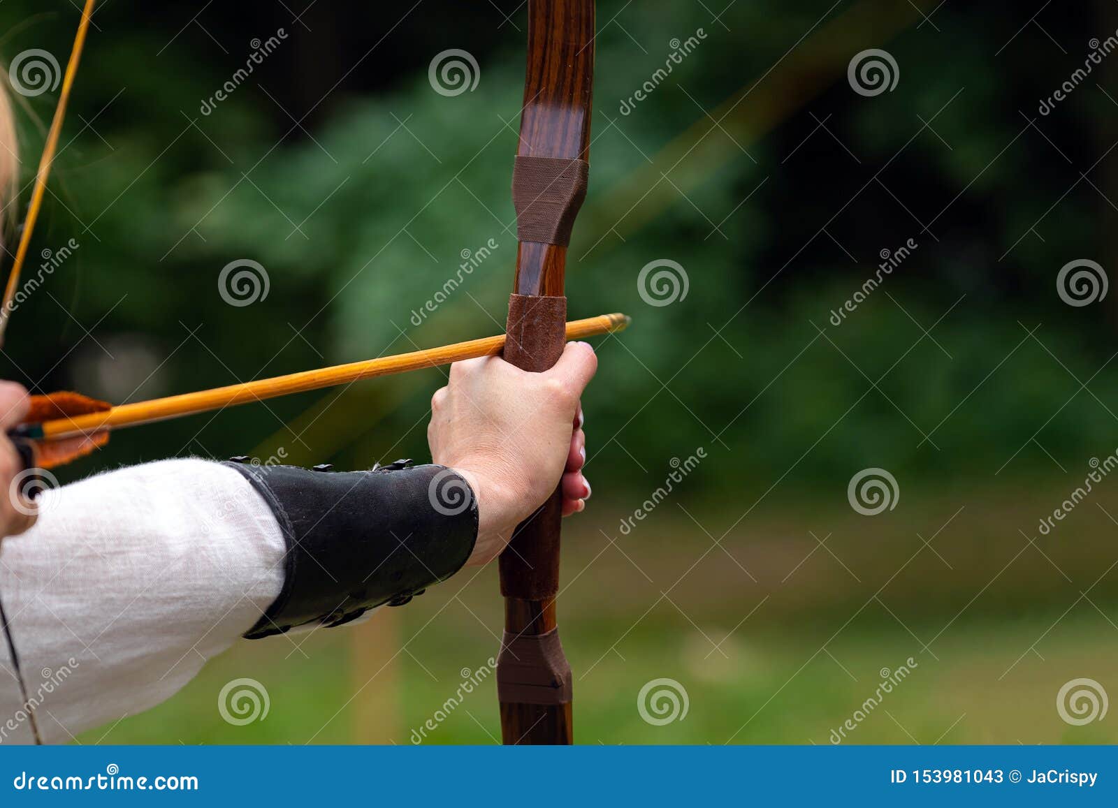 Archer Holds His Bow Aiming at the Target. Archery Competition, Outdoor ...