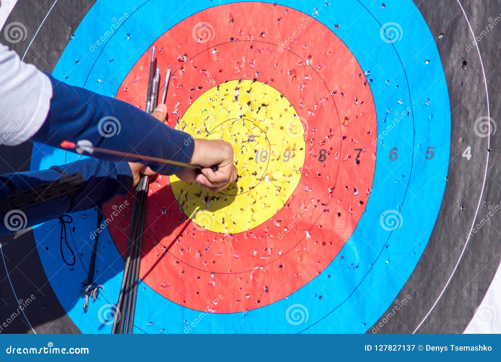 Archer Pulls Arrows from Target Stock Image - Image of outdoor, hood ...