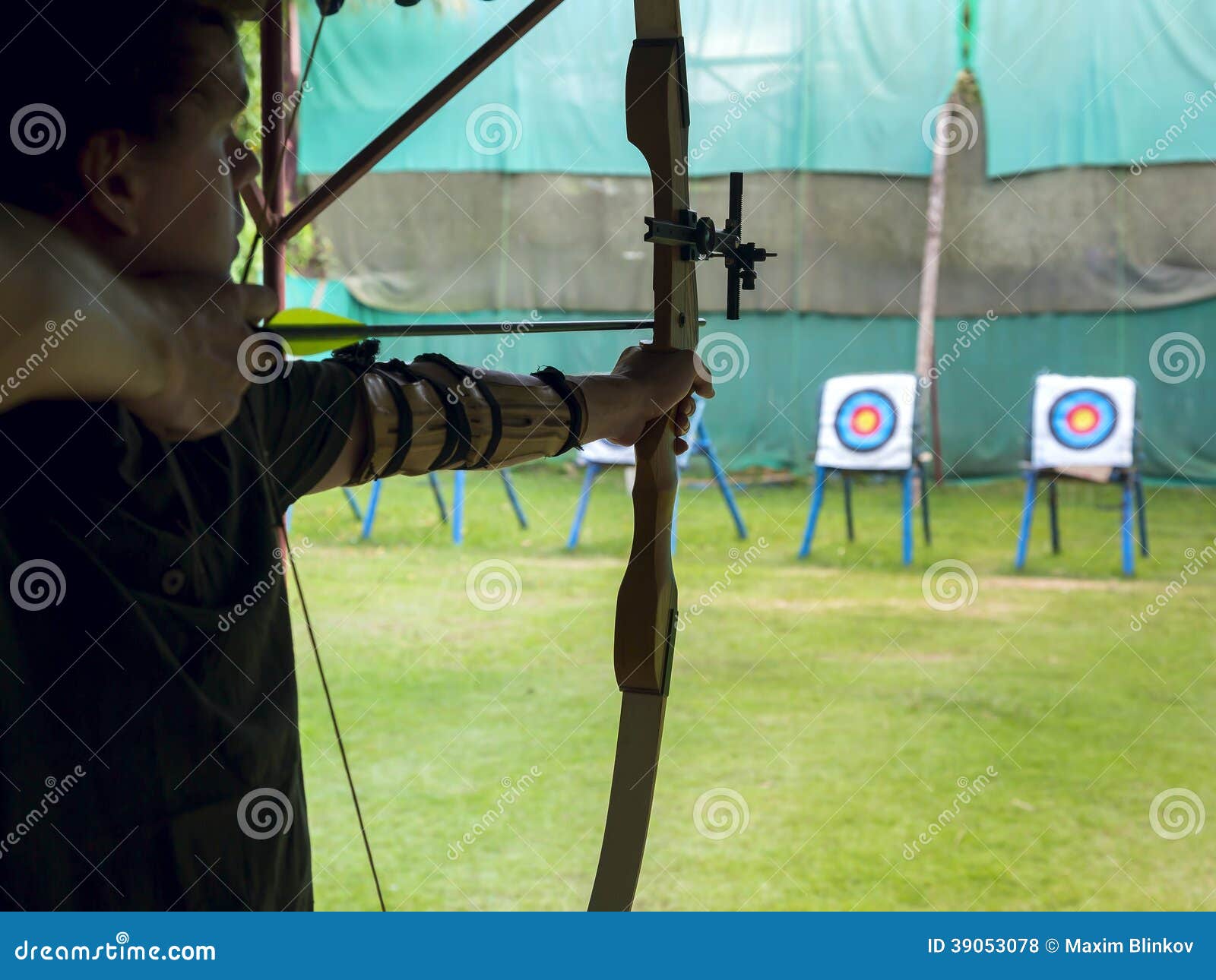 Archer Takes Aim at a Target Stock Photo - Image of grass, hold: 39053078