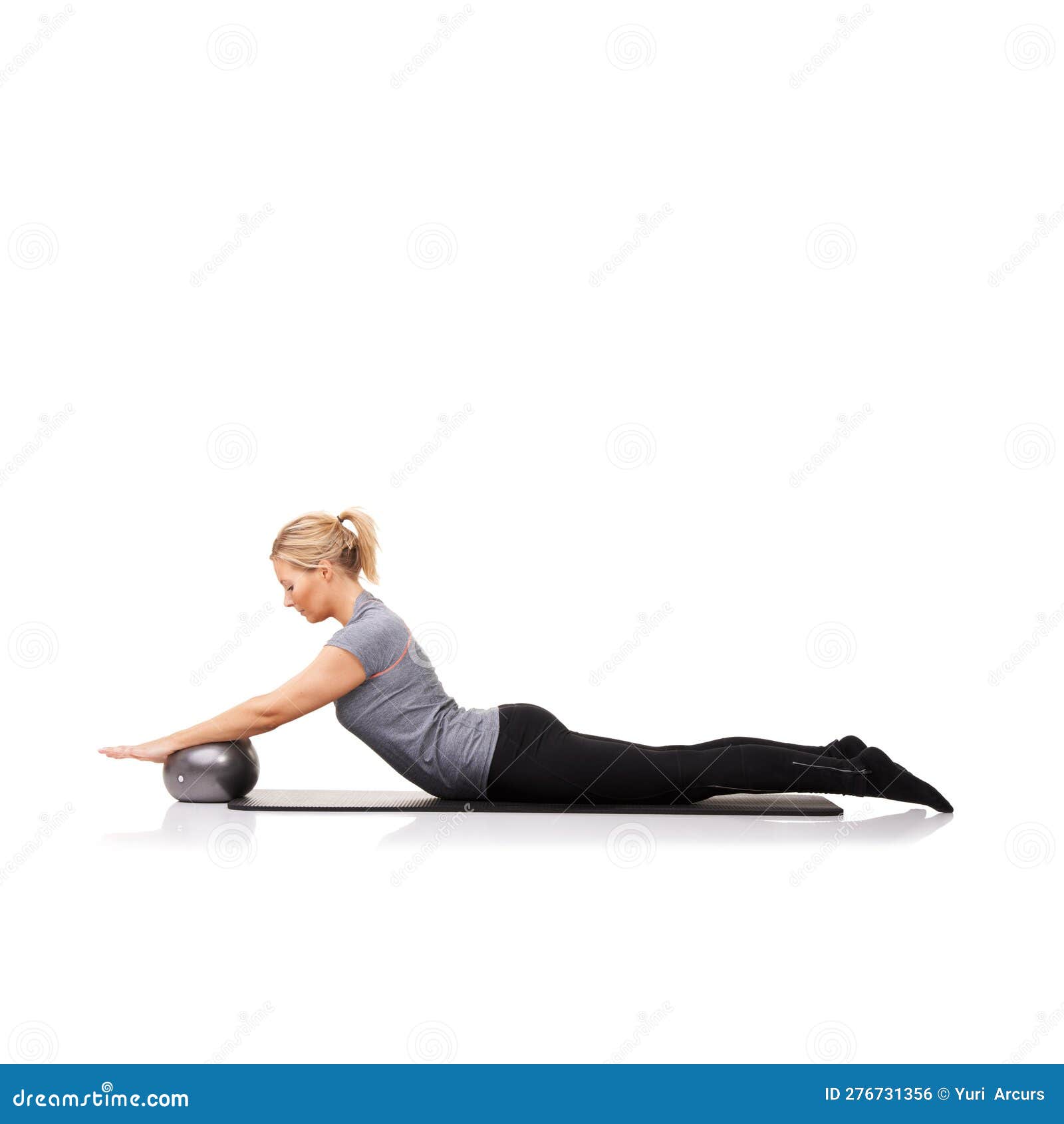 Arching Her Back and Forcing it Down. a Young Woman Using an Exercise ...