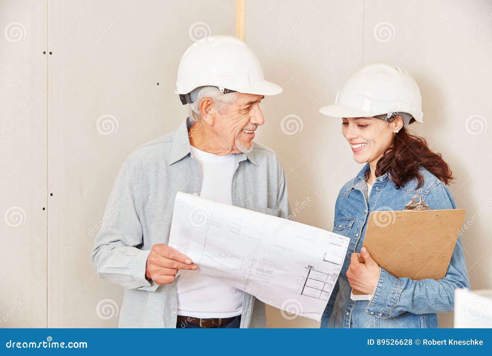 Architect with Architectural Drawing and Apprentice Stock Photo - Image ...