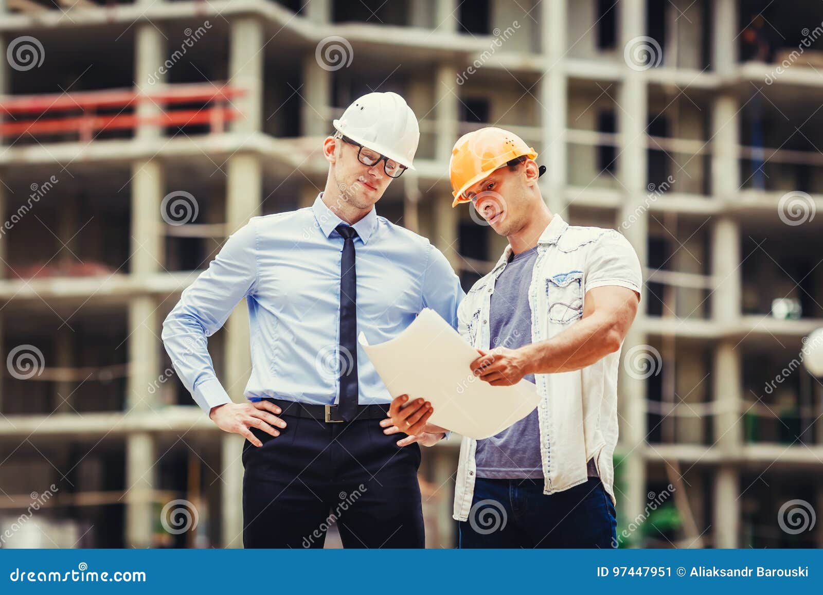 Architect and Builder Discussing at Construction Site Stock Image ...