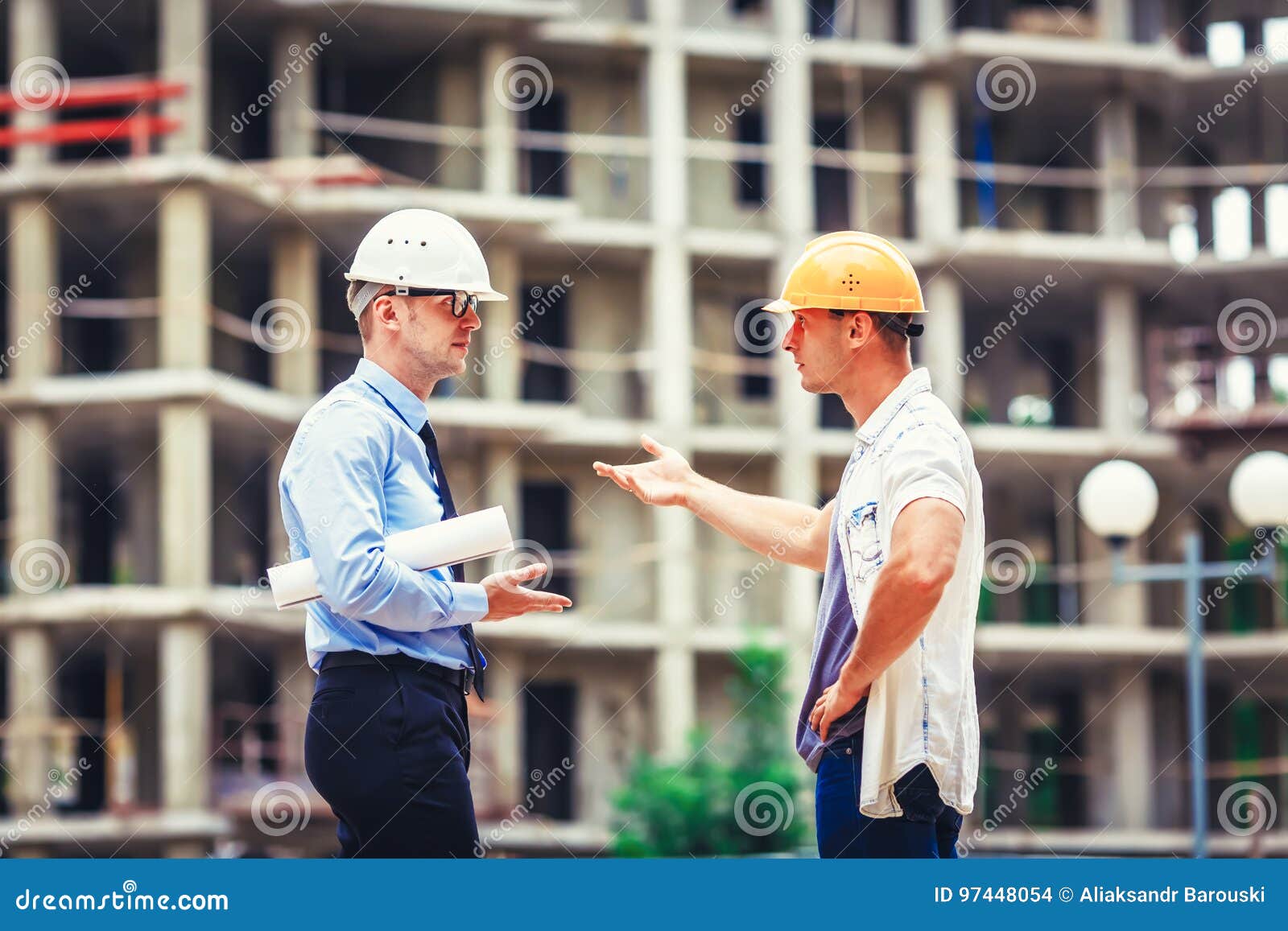 Architect and Builder Discussing at Construction Site Stock Photo ...