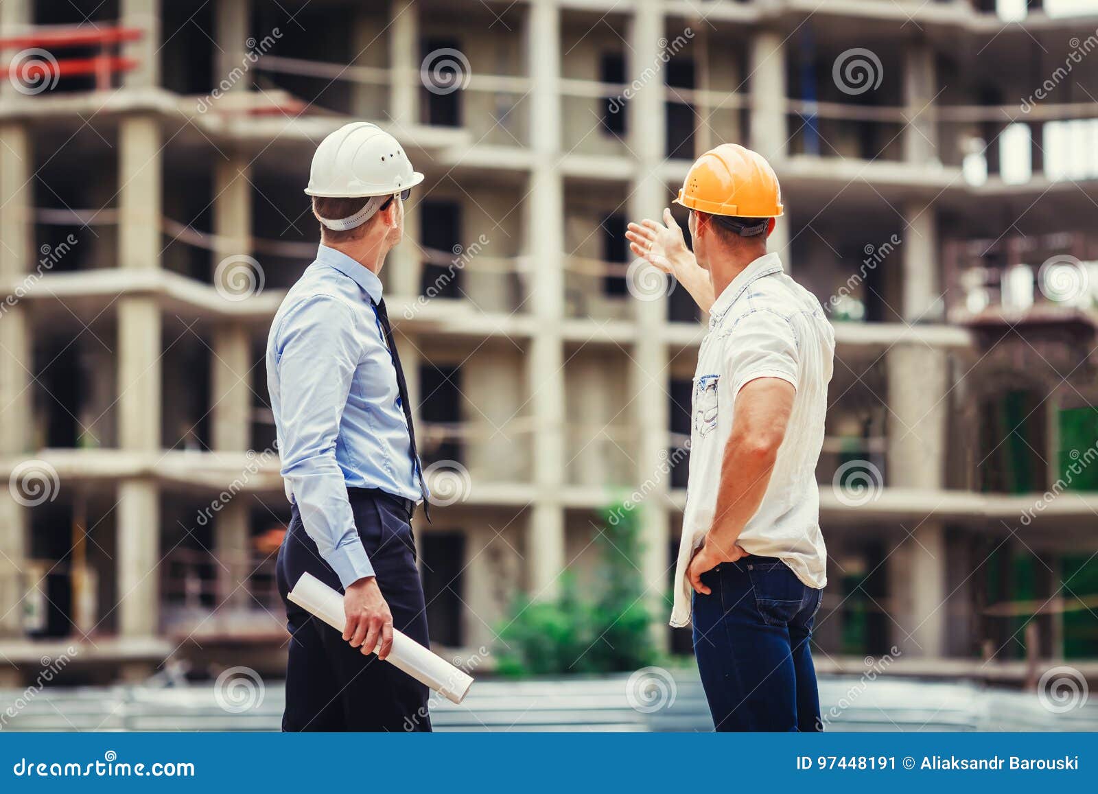 Architect and Builder Discussing at Construction Site Stock Image ...