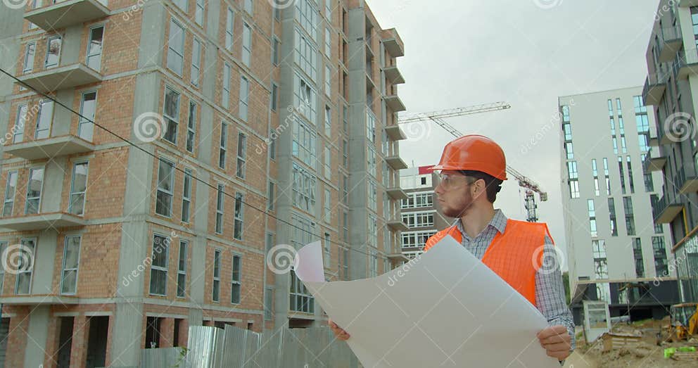 Architect or Builder Man Walking on the Construction Site and Analyzing ...