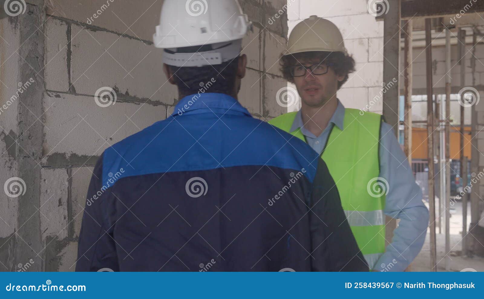 Architect and Builder Talking and Inspector Construction at ...