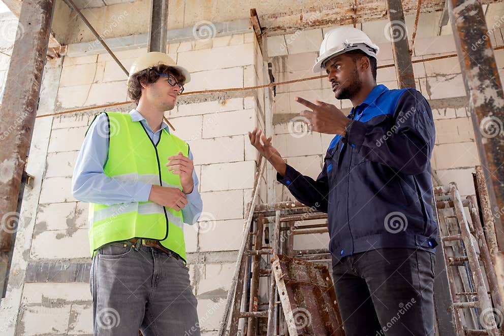 Architect and Builder Talking and Inspector Construction at ...