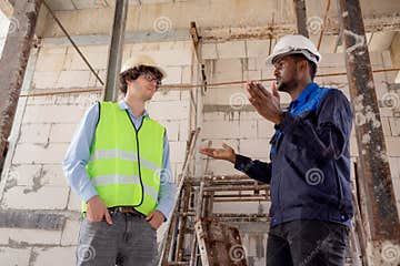 Architect and Builder Talking and Inspector Construction at ...