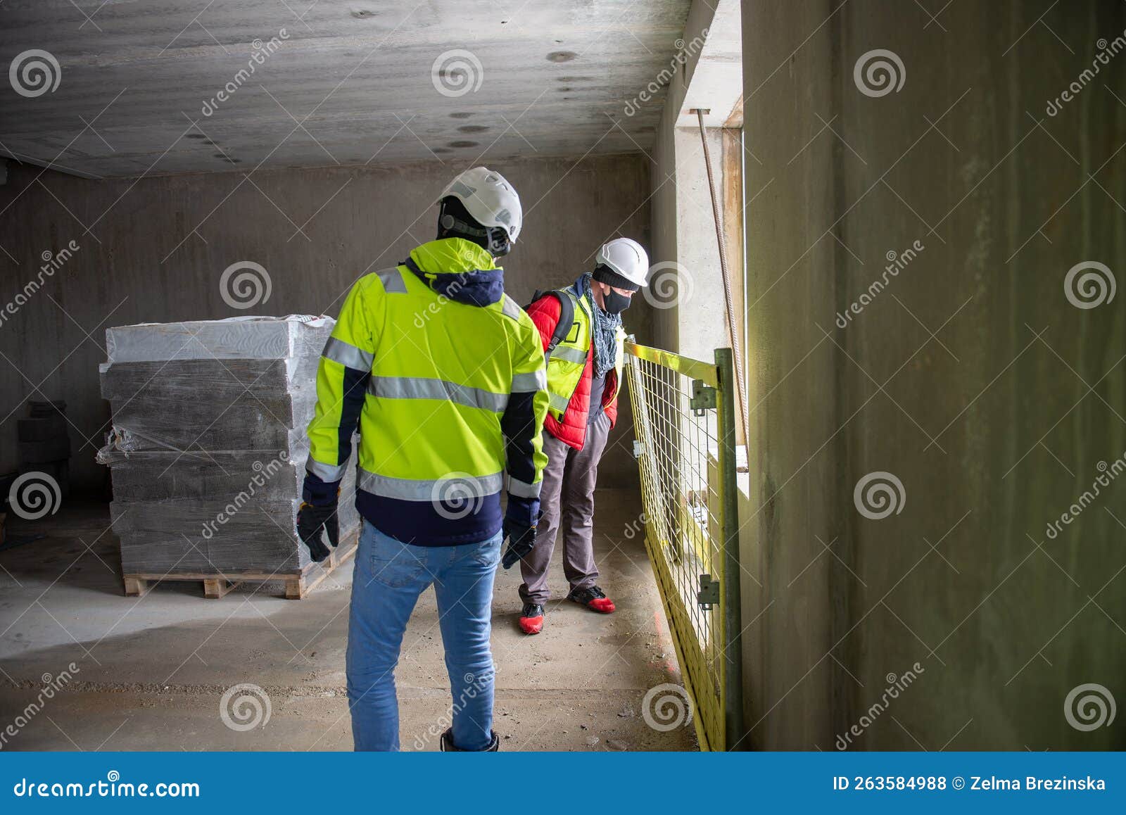 The Architect of the Building Project and the Construction Manager Walk ...