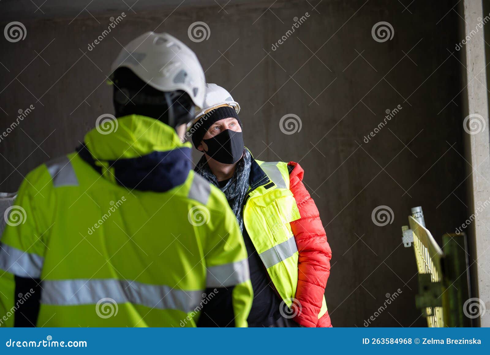 The Architect of the Building Project and the Construction Manager Walk ...