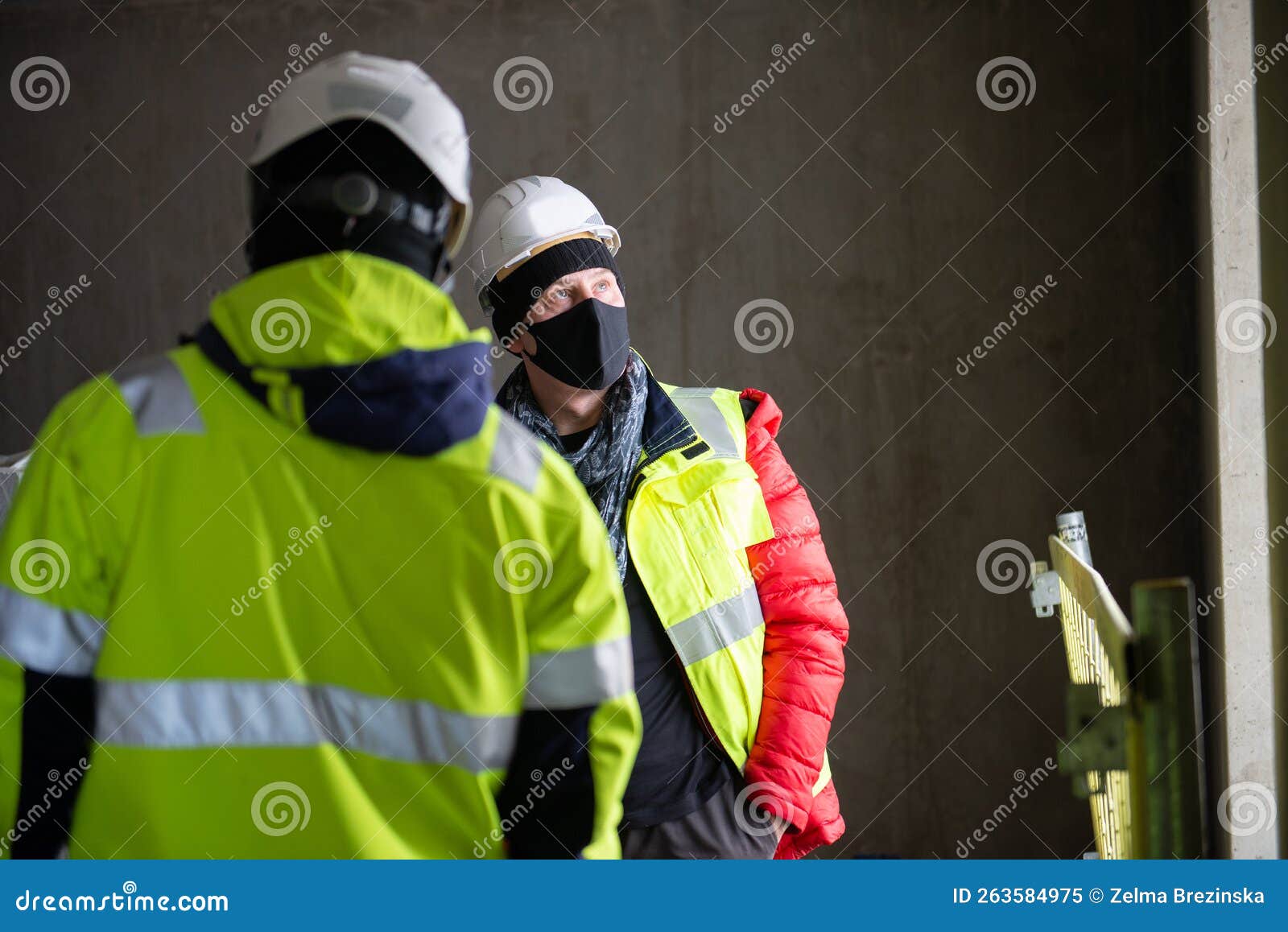 The Architect of the Building Project and the Construction Manager Walk ...