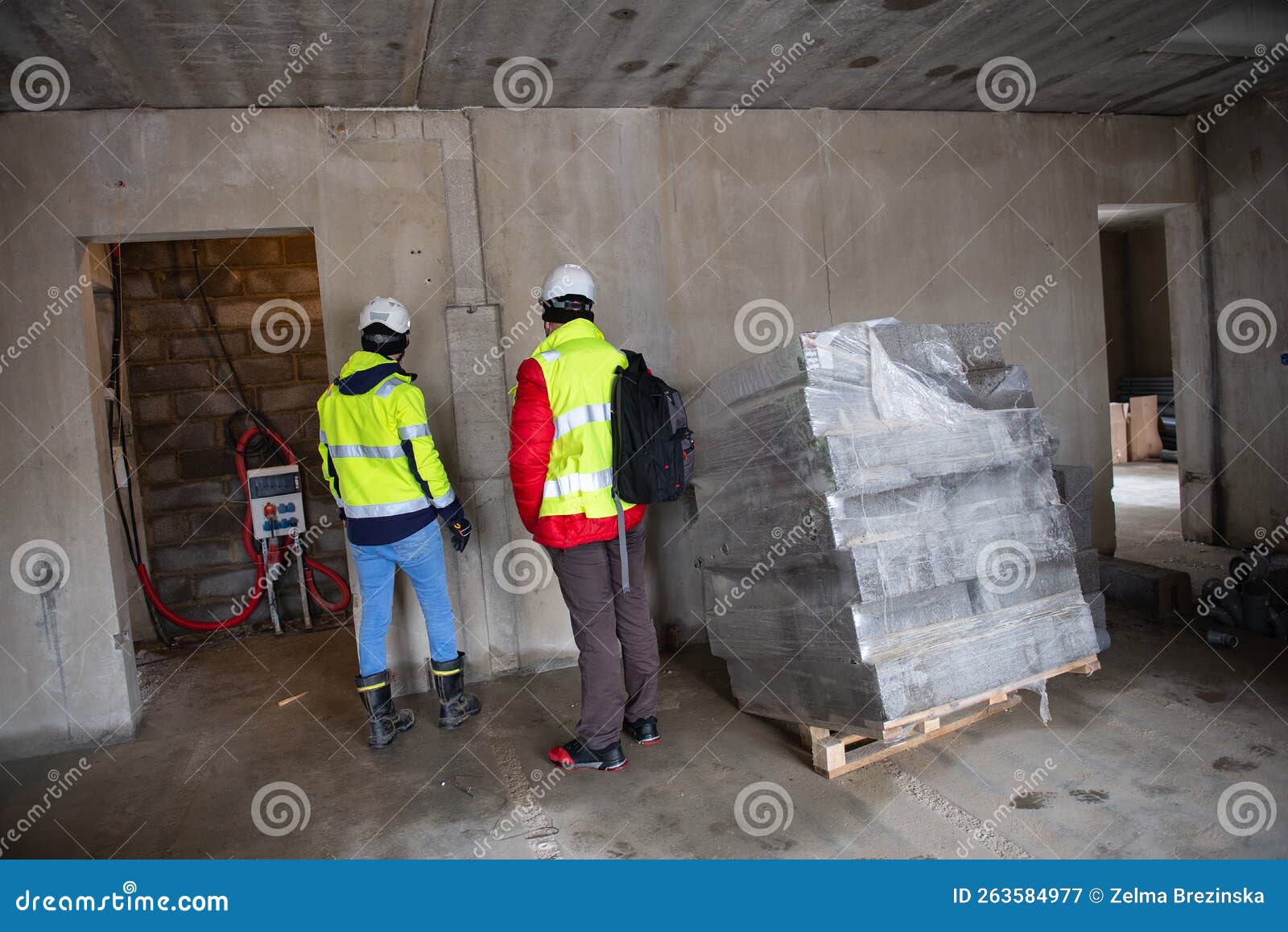 The Architect of the Building Project and the Construction Manager Walk ...