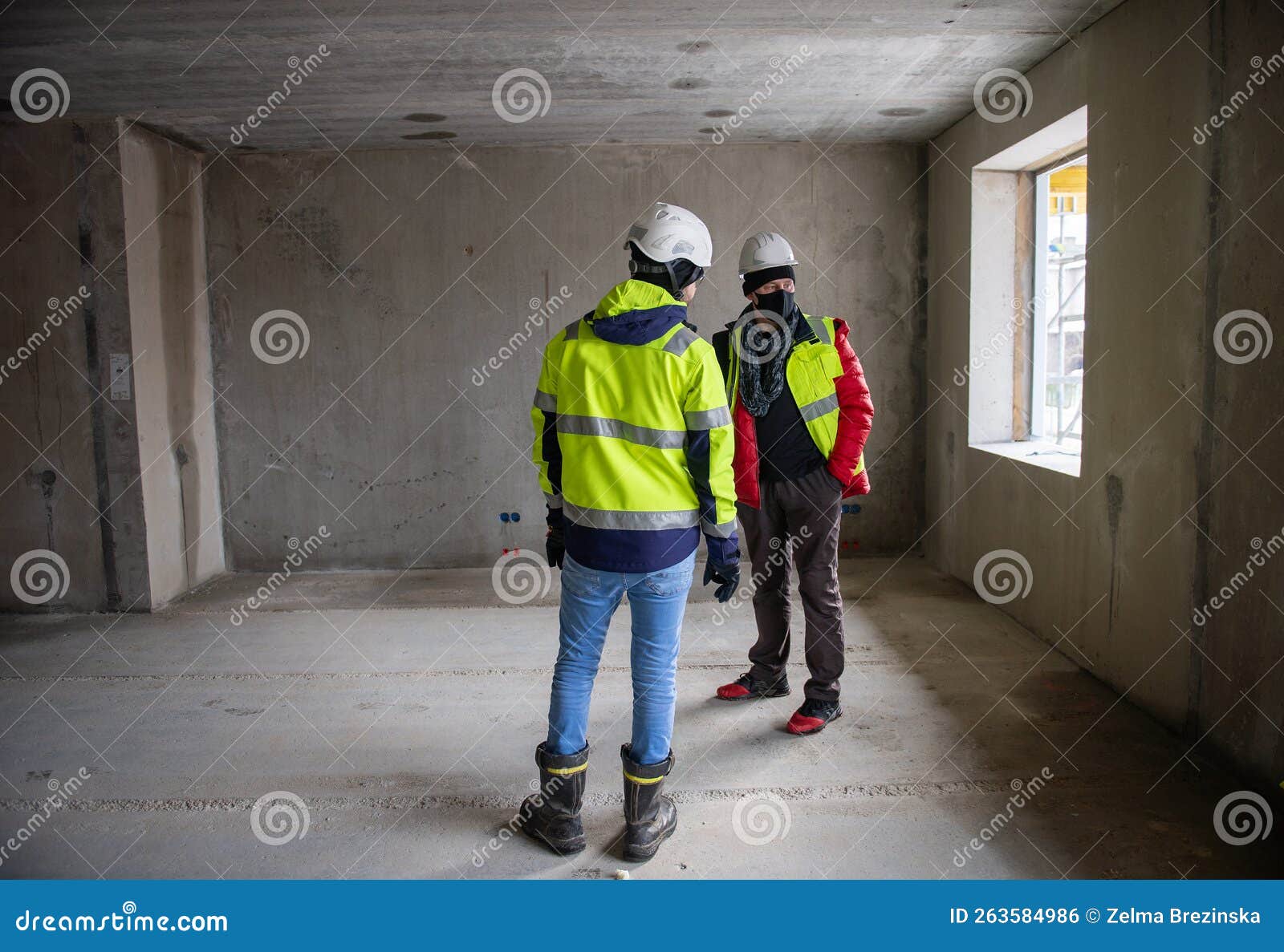 The Architect of the Building Project and the Construction Manager Walk ...