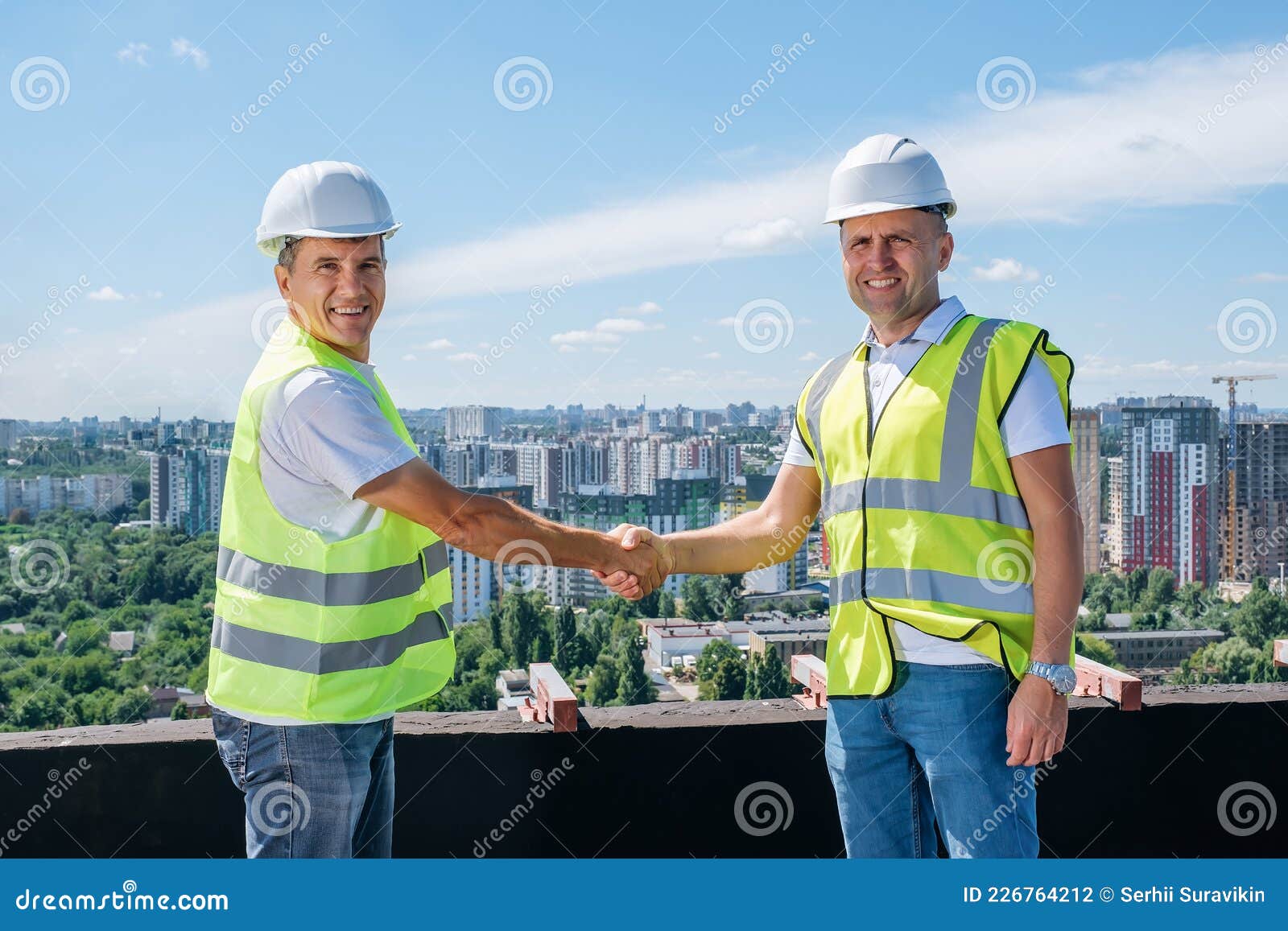 Architect and Civil Engineer Shaking Hands on the Construction Site ...