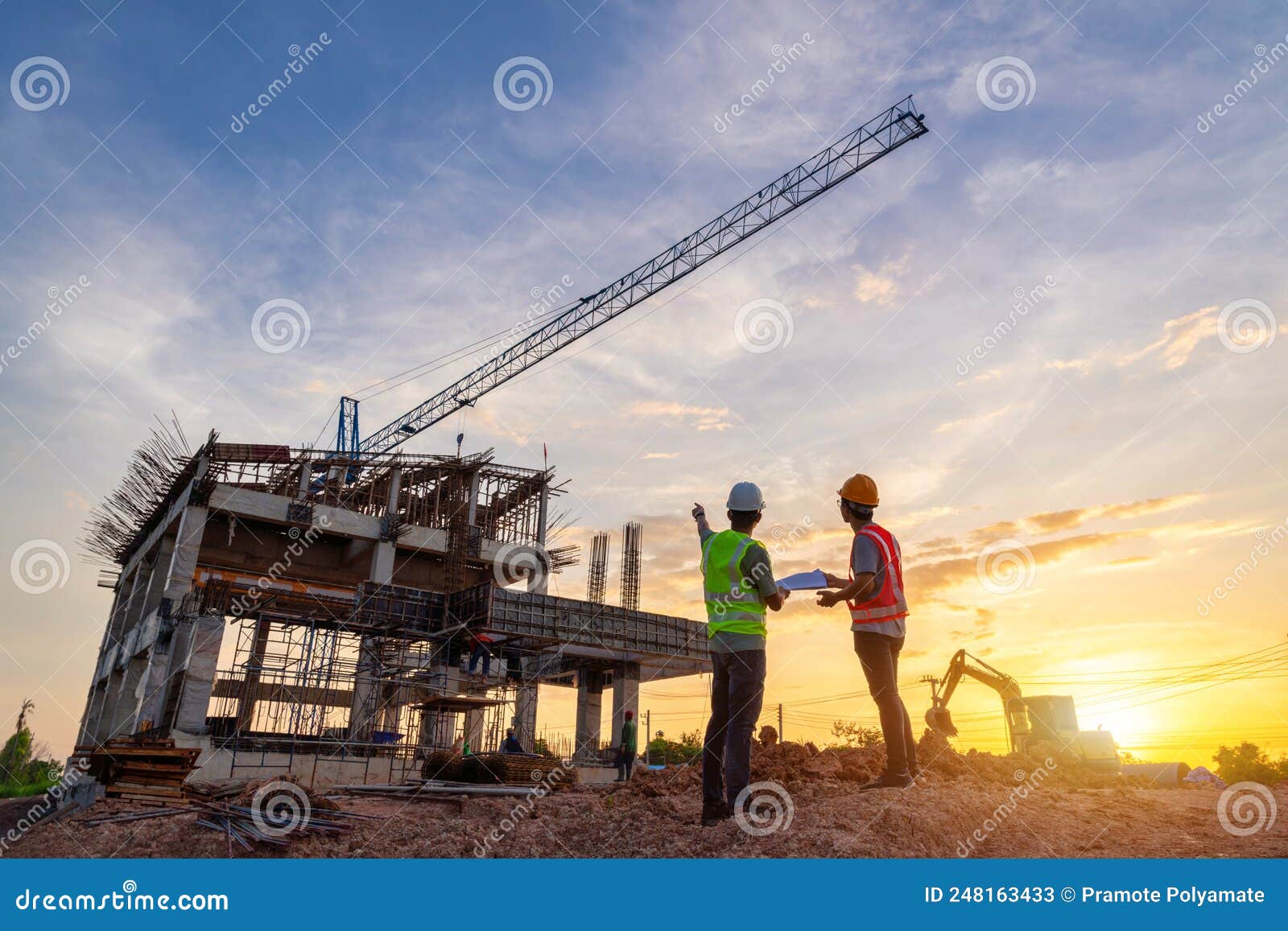 An Architect / Civil Engineer At Work On A Construction Site, Holding ...