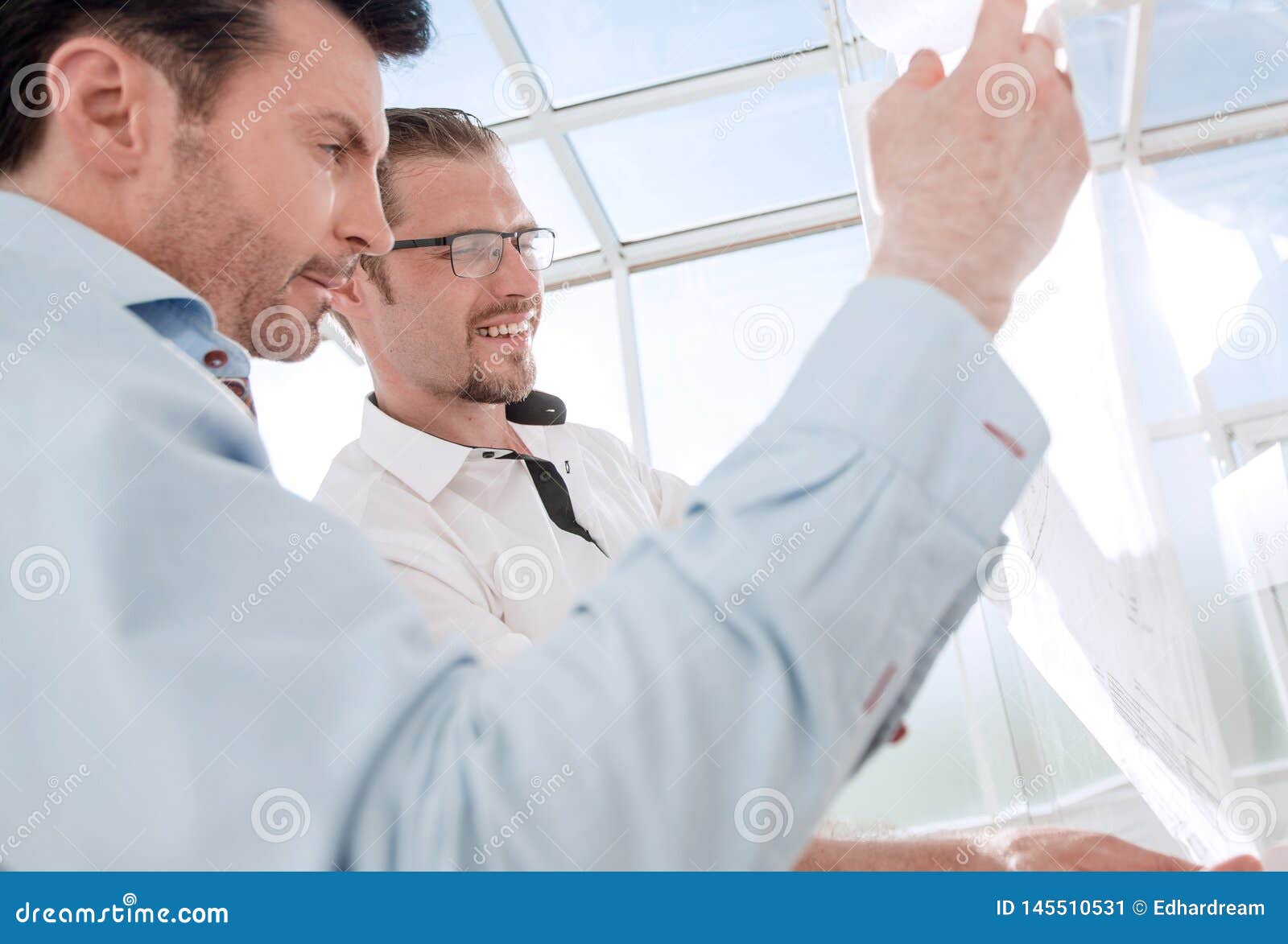 Architect and Client Discussing the Project on an Electronic Screen ...