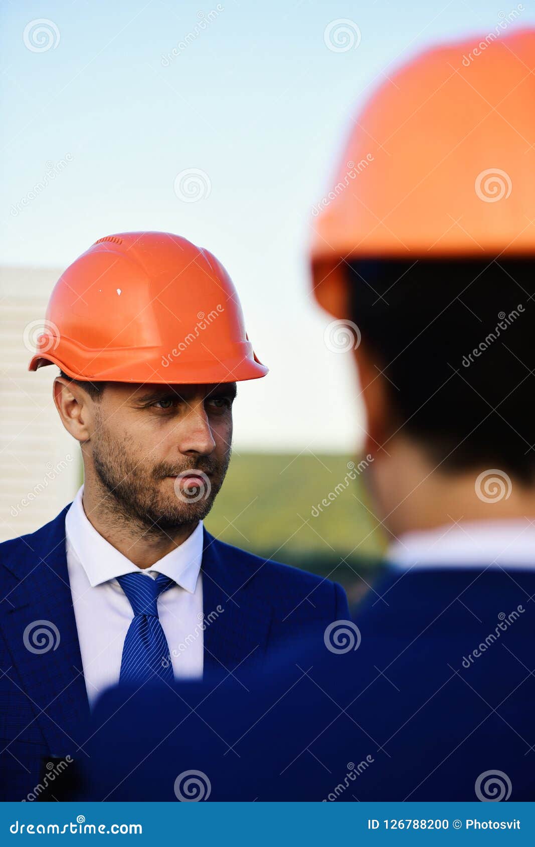 Architect with Confident Smile in Formal Wear and Orange Helmet. Stock ... Architect with Confident Smile in Formal Wear and Orange Helmet. Stock ...