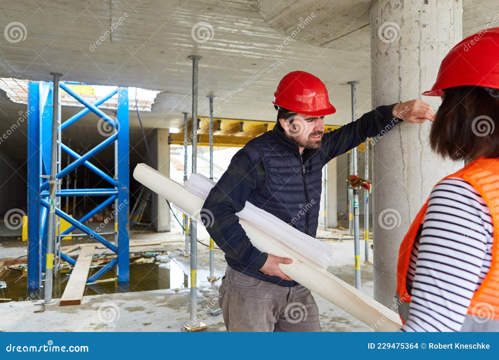 Architect with Construction Drawing Discusses Construction Work Stock ...
