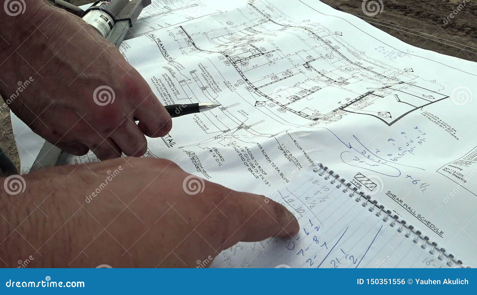 An Architect and a Construction Engineer Check the Building Plan of the ...