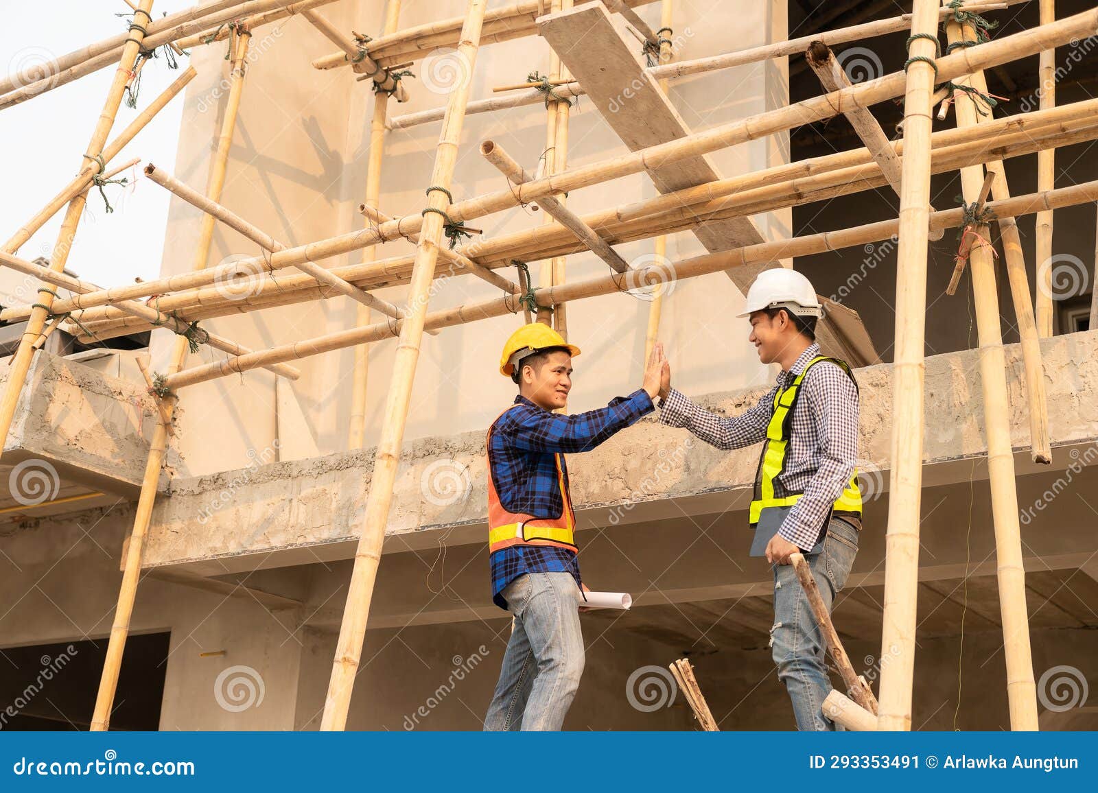 Architect and Construction Engineer Holding Hands while Working for ...
