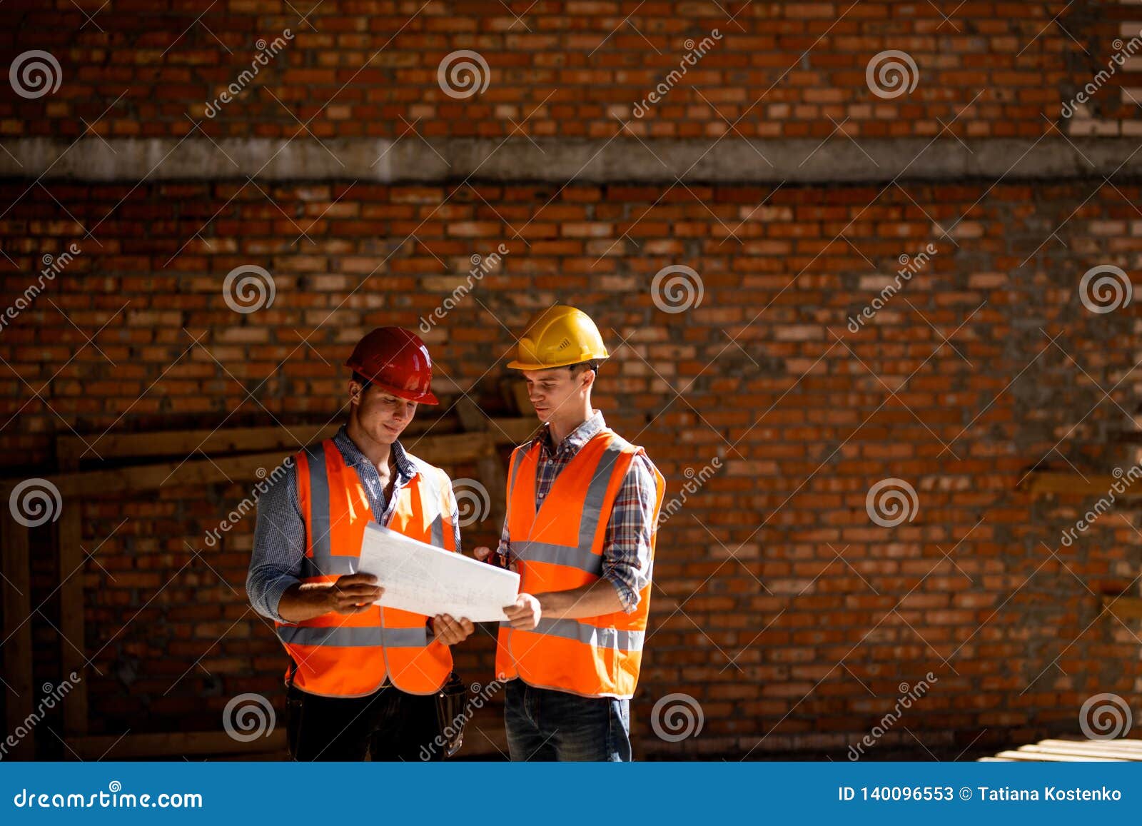 Architect and Construction Manager Dressed in Orange Work Vests and ...