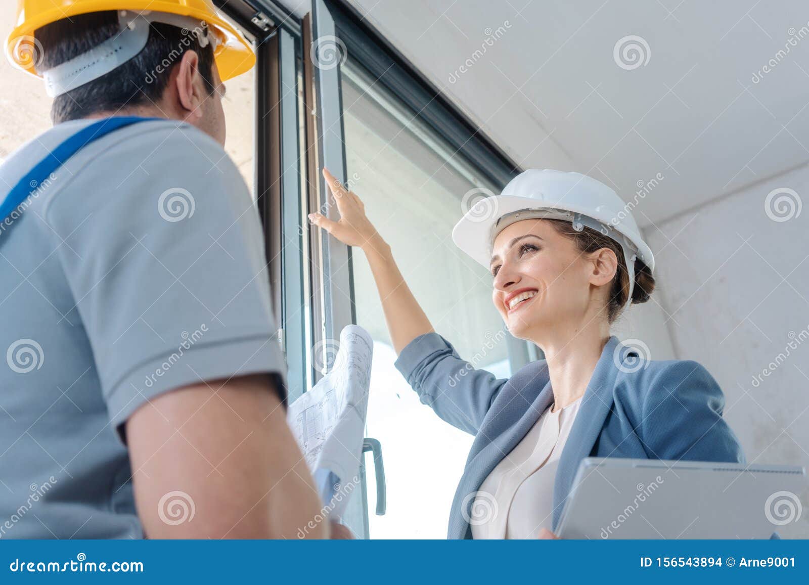 Architect and Construction Worker Checking Windows on Site Stock Photo ...