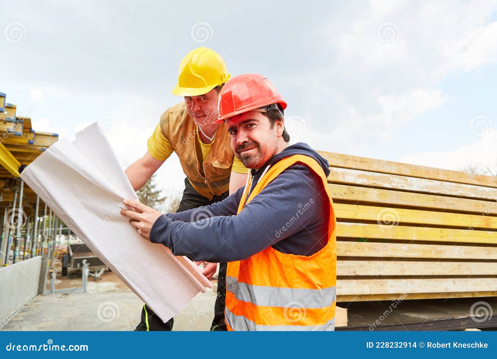 Architect and Construction Worker on Construction Site with Floor Plan ...