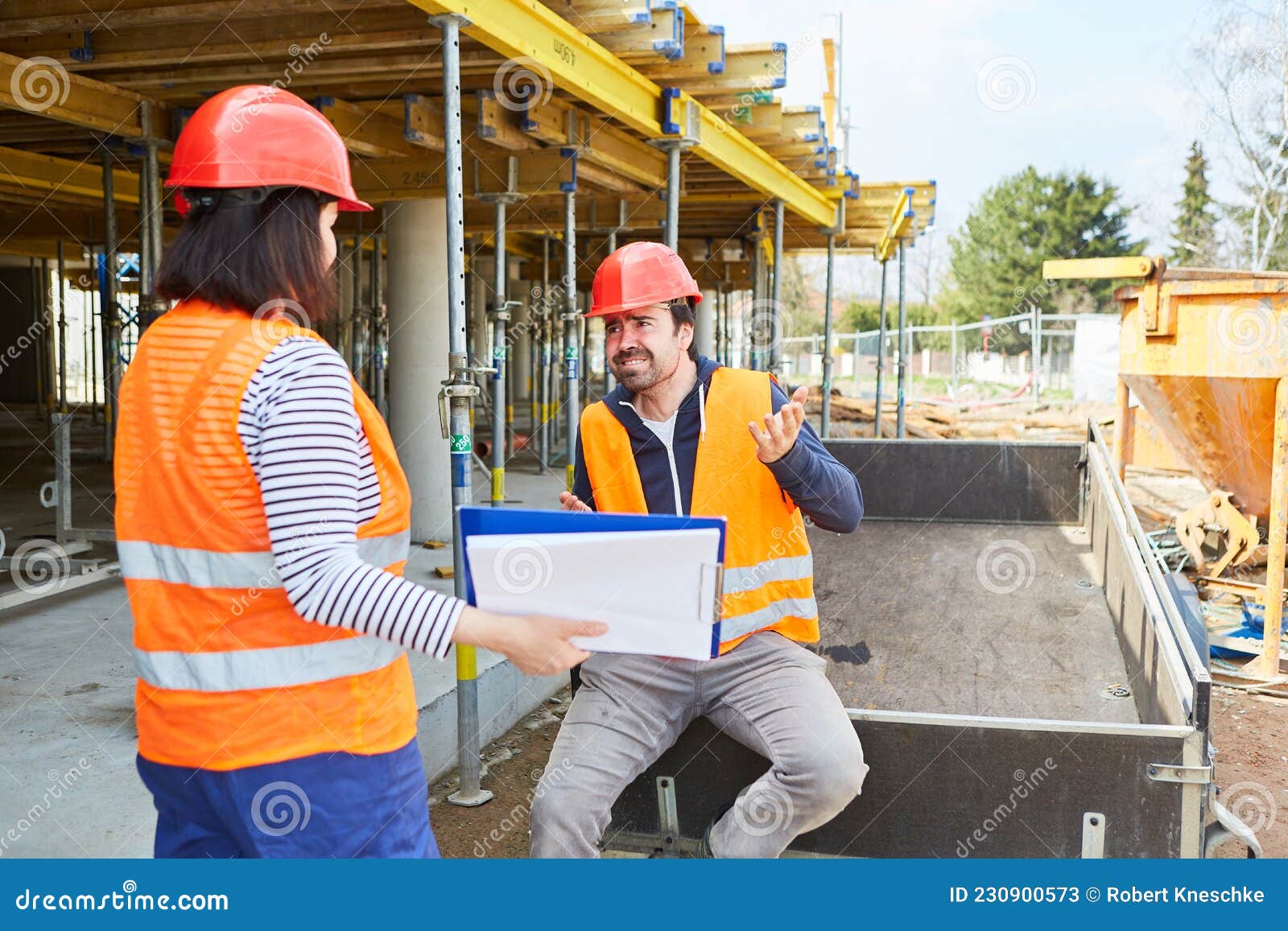 Architect and Construction Worker Discuss Construction Project Stock ...