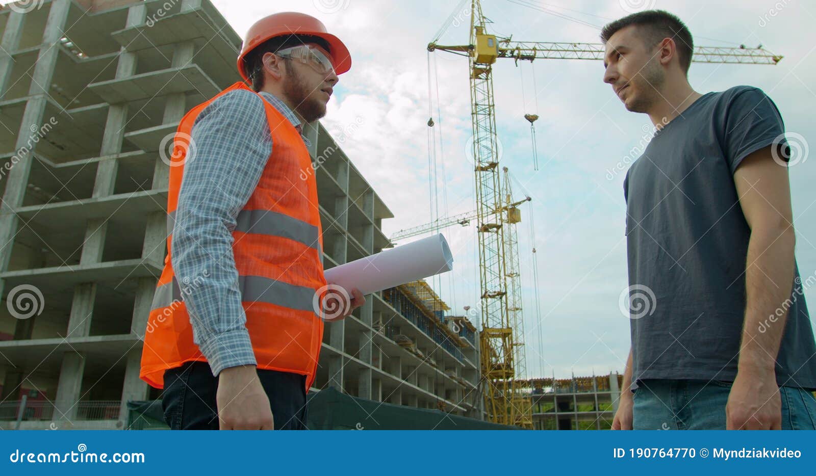 Architect Contractor Shaking Hands with Client at Construction Site ...