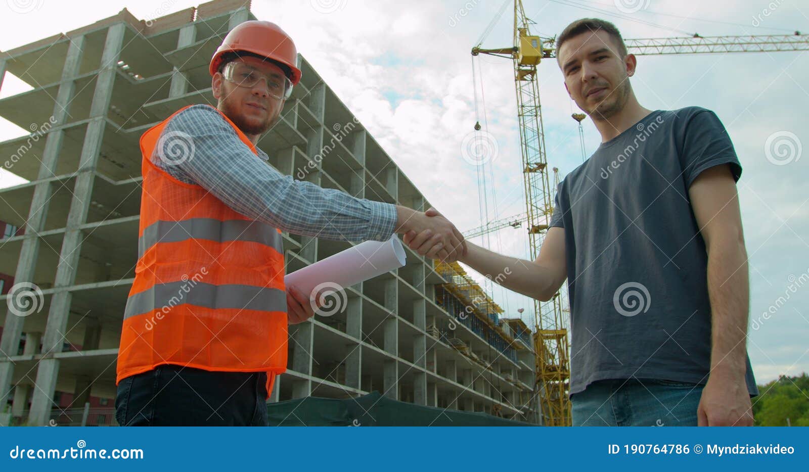 Architect Contractor Shaking Hands with Client at Construction Site ...