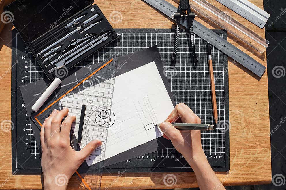 Architect and Designer Working Accurately on a Project Drawing Sketches ...
