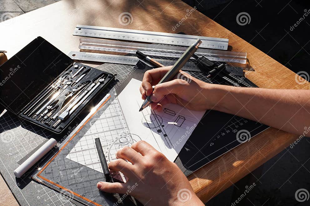 Architect and Designer Working Accurately on a Project Drawing Sketches ...