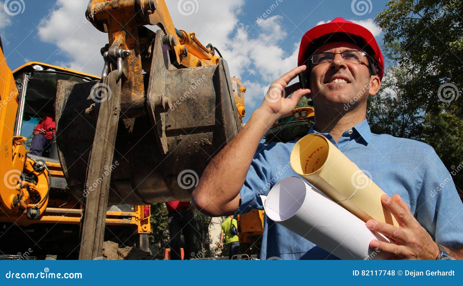 Architect or Engineer with Cell Phone on the Construction Site Stock ...