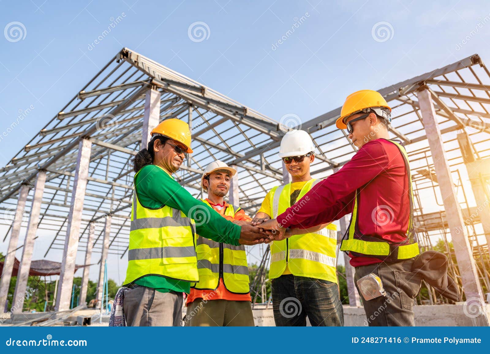 Architect and Engineer Construction Workers Join Hands while Working at ...