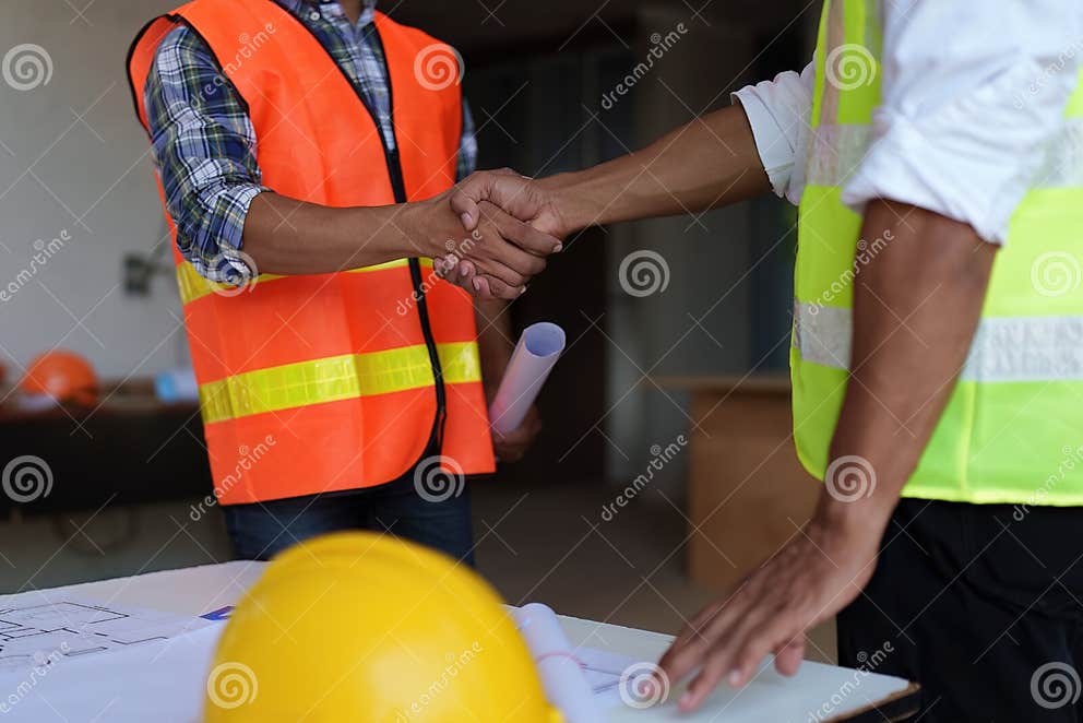 Architect and Engineer Construction Workers Shaking Hands after Finish ...