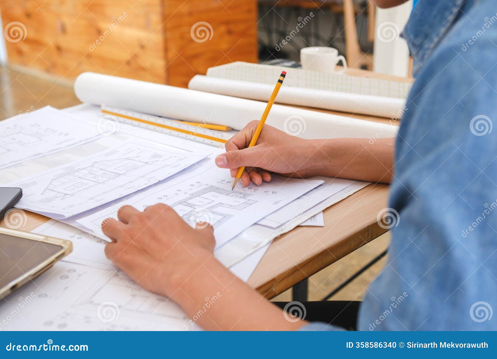Architect and Engineer Drafting Blueprints with a Pencil and Ruler at a ...