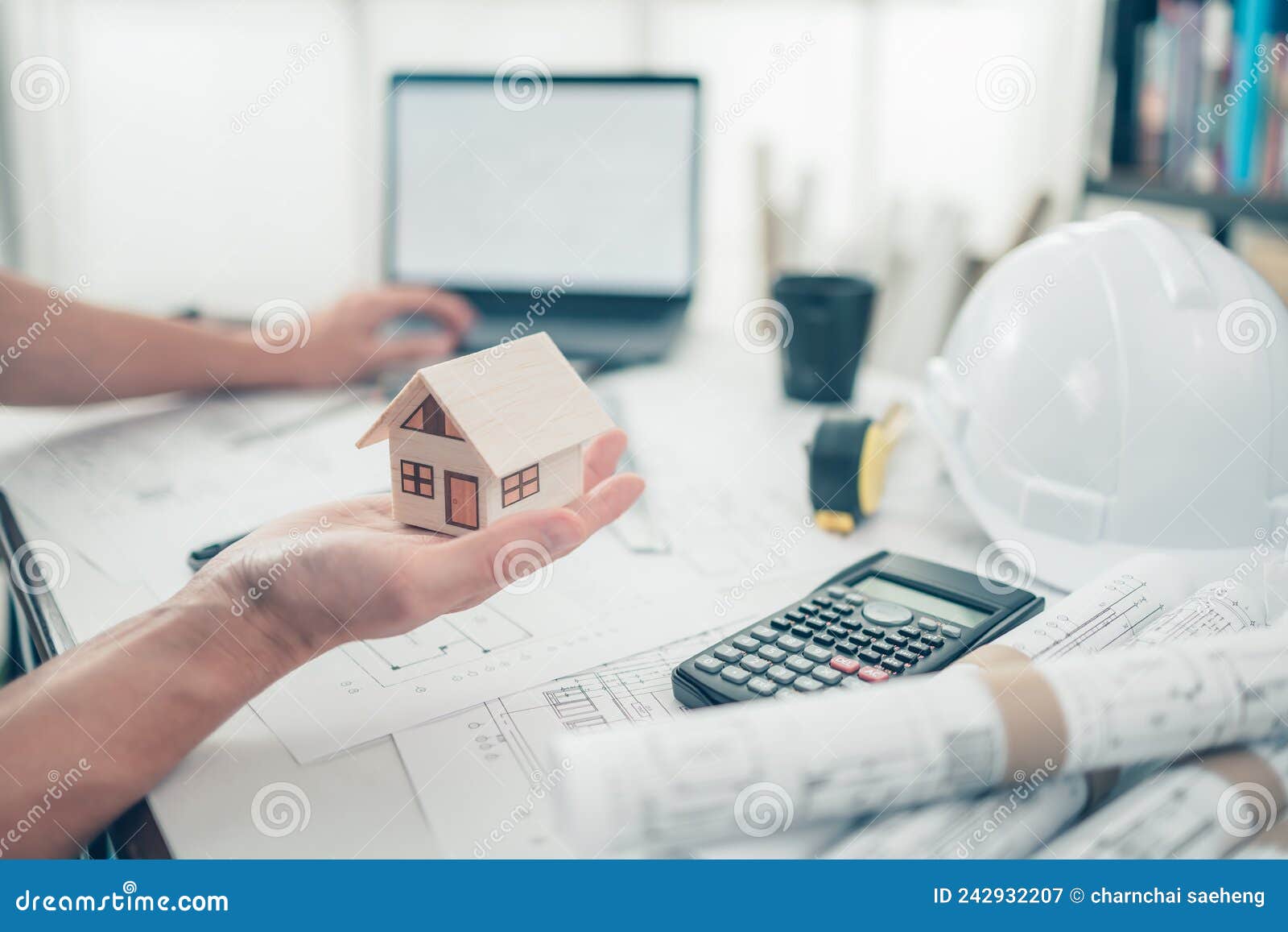 Architect Engineer Hands Hold and Show Mini House Model and Use Laptop ...