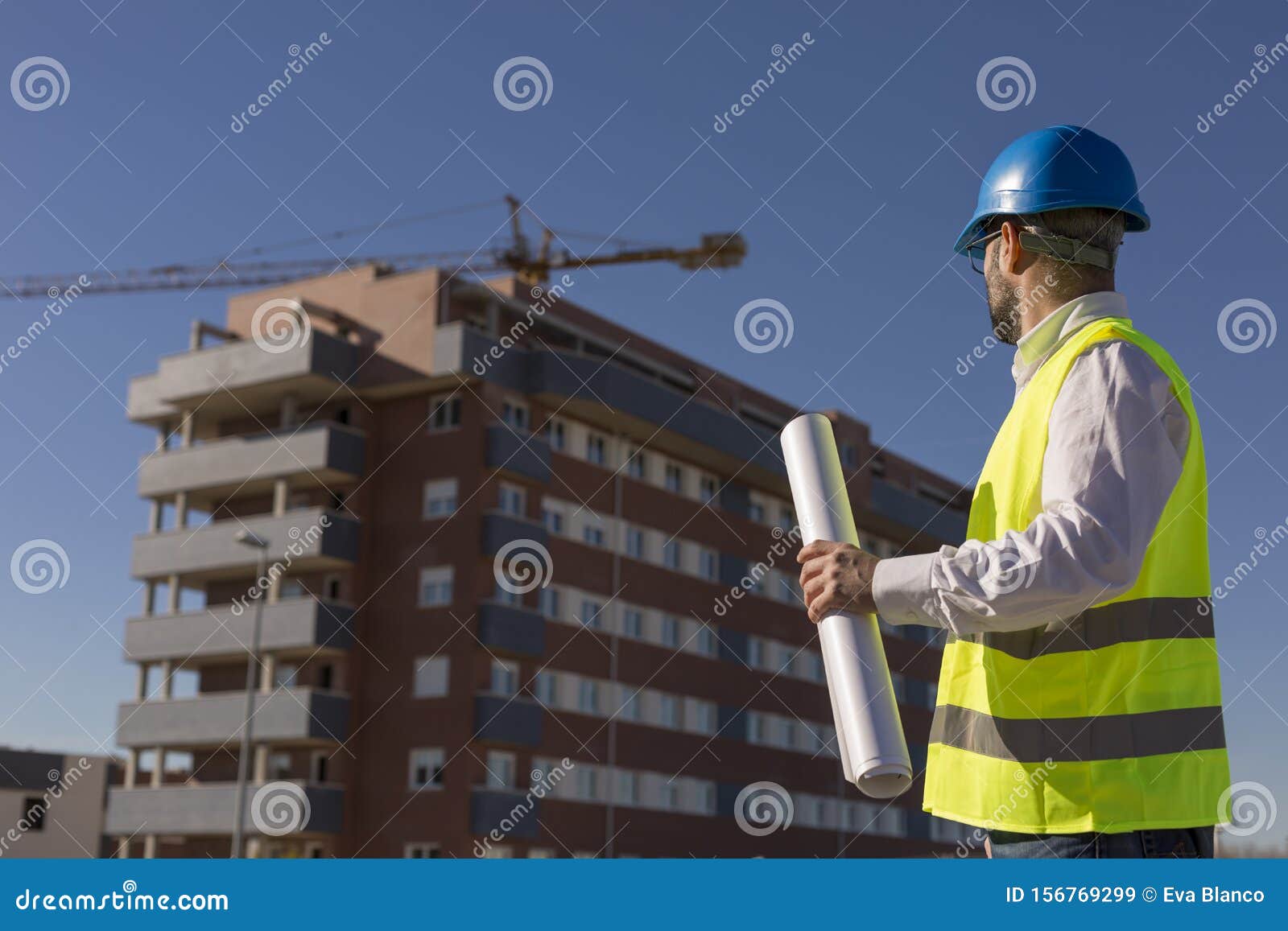 Architect or Engineer Holding Blueprints on the Construction Site ...
