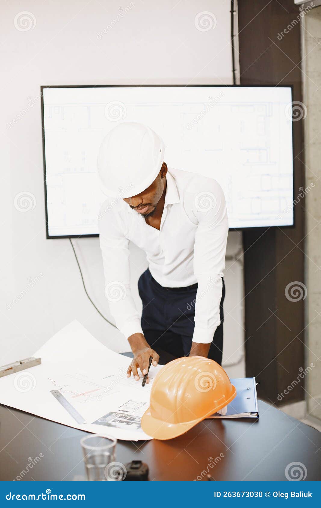 Young Manager in the Office with Helmet Stock Photo - Image of ...
