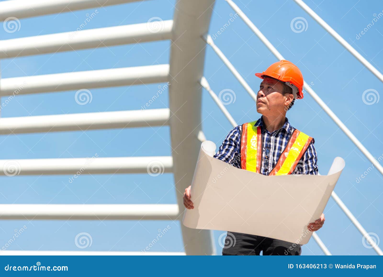 Architect Engineer Planning Blue Print in Construction City Site Stock ...